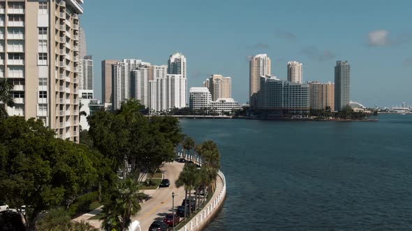 Cinematic aerial reveal of downtown Miami waterfront buildings over ...