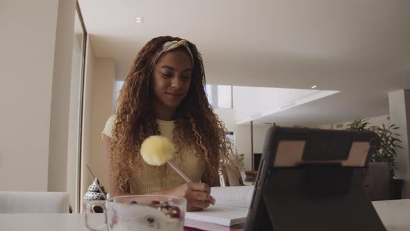 Young Lady Studying From Home During a Live Virtual Class, Stock Footage