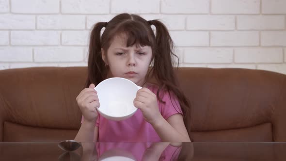 Hunger. A child with an empty plate., Stock Footage | VideoHive