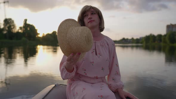 Portrait of Charming Adult Transgender Woman Using Straw Hat As Hand ...