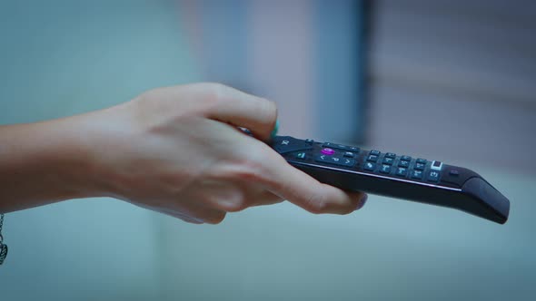 Television Remote Control in Woman Hands Pointing To Tv, Stock Footage