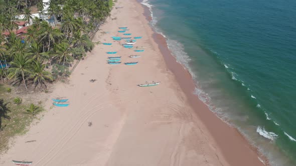 Kahanda Modara beach in Sri Lanka. Boats resting on the beach before ...