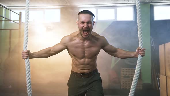 Young Muscular Man Screaming in Anger After Exhausting Workout in the ...