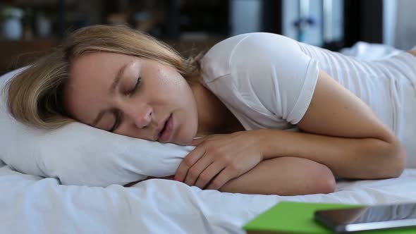 Pretty Young Woman Snoring in Bed, Stock Footage | VideoHive