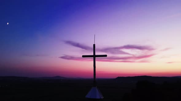 Silhouette of orthodox church cross against pink sunset sky, Stock Footage