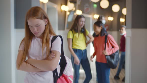 Unhappy Schoolgirl Being Gossiped and Laughed at By Classmates, Stock ...