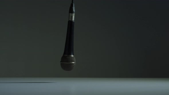 Microphone swinging in a darkened room, Stock Footage | VideoHive