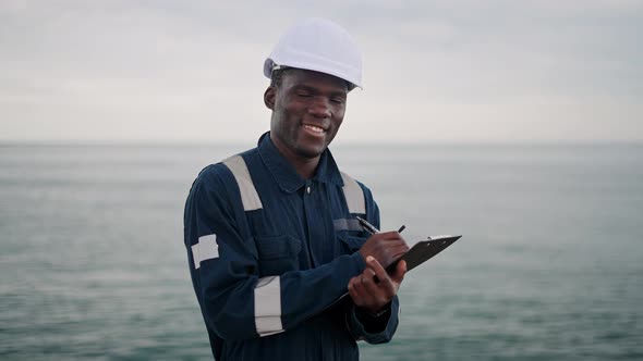 Friendly Black Seaman Making Notes, Stock Footage | VideoHive
