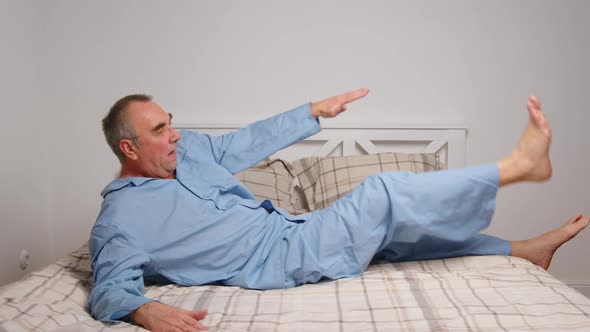 Happy Vivacious Older Man Doing Exercises Comfortable Bed, Stock Footage