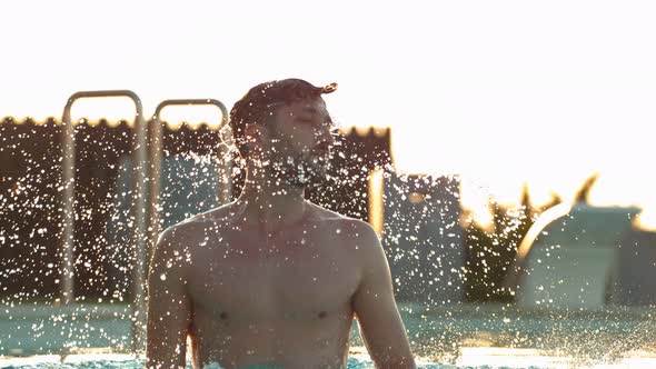 Man shaking water from hair and body, Ultra Slow Motion, Stock Footage