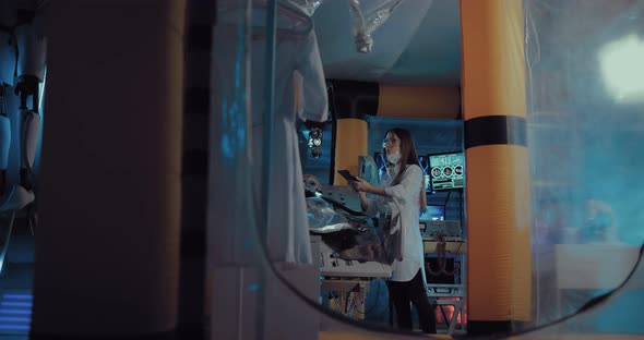 Alien Lies on the Operating Table in the Laboratory Connected to a ...