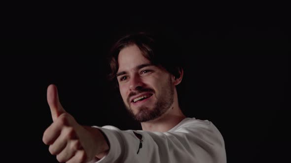 Trendy Young Man giving thumbs up, appreciative reaction, close, black ...