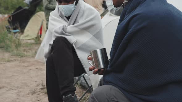 Two Refugee Men in Face Masks Talking Outdoors, Stock Footage | VideoHive
