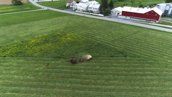 Amish Farm Worker Harvesting the Field in Spring With 4 Horses and 3 ...