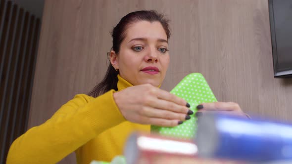 Girl at Home Fiddling with Gifts, Stock Footage | VideoHive