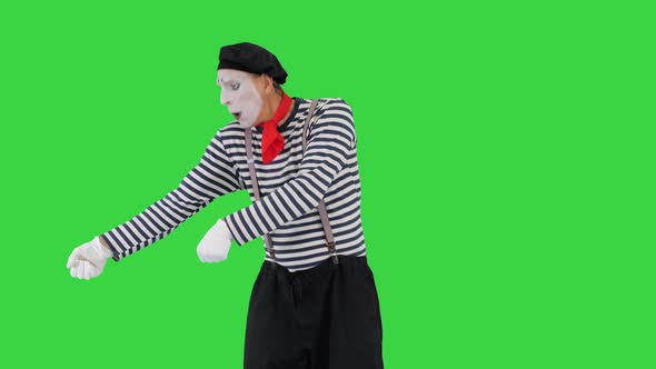 Mime Pulling an Imaginary Rope on a Green Screen, Chroma Key., Stock ...