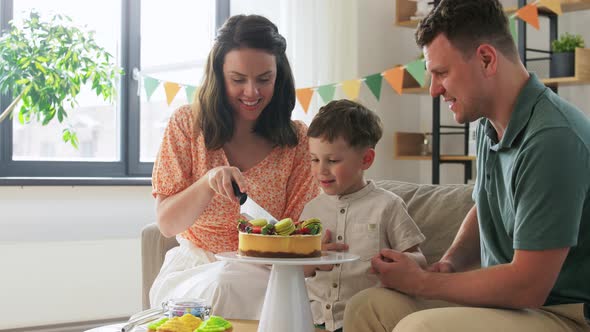 Happy Family Sharing Birthday Cake at Home, Stock Footage | VideoHive