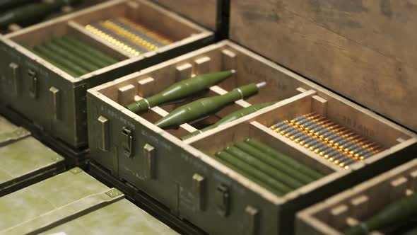 Opened military box with RPG projectiles and rifle ammunition. Endless ...