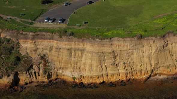 AERIAL TILT UP Revealing Coastal Township With Limestone Cliff Faces ...