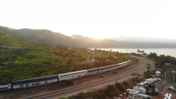 A passenger train traveling down the Ventura, California coast line ...
