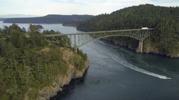 Helicopter Filming Boat Cruising Under Large Pacific Northwest Bridge ...