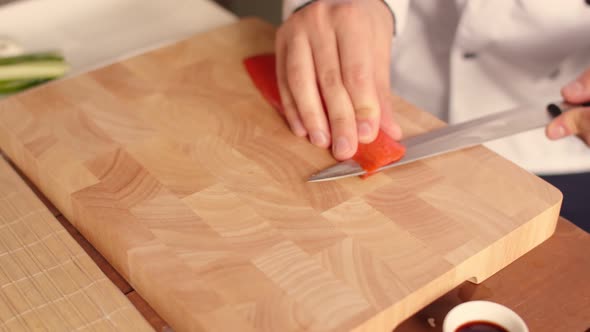 Man Hands of Chef Cut Up Piece of Fish By Cutting Knife, Stock Footage