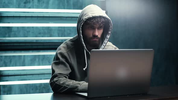 Portrait of Bearded Hacker Man Wearing Sweatshirt with Hood Breaking ...