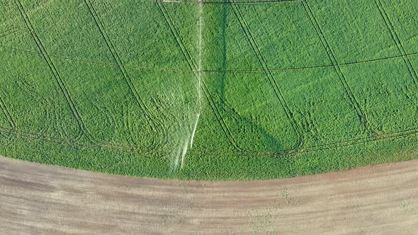 Aerial view drone shot of irrigation system rain guns sprinkler on ...