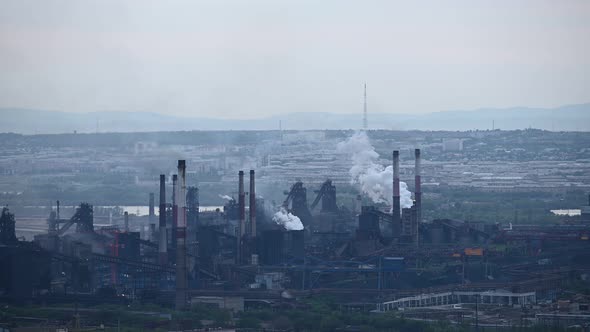 Time Lapse of Working Factory Producing Air Pollution Against the City ...
