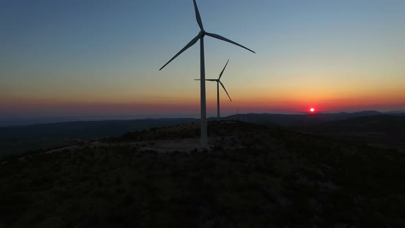 Flying over windmills at dusk, Stock Footage | VideoHive