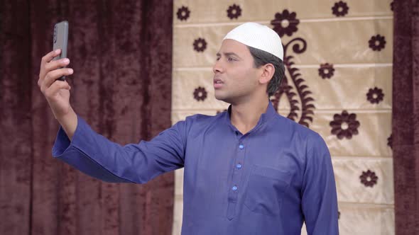 Indian Muslim man talking on video call, Stock Footage | VideoHive