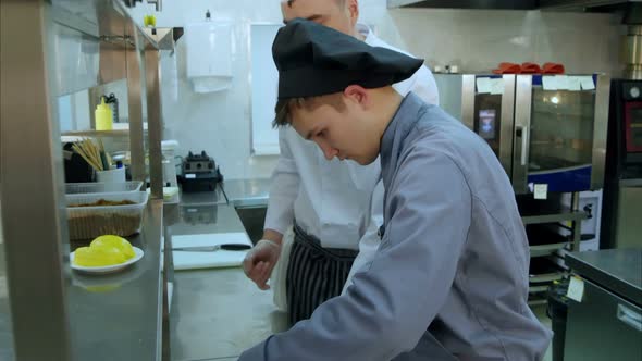 Cook Trainee Learning To Serve Vegetables on a Plate, Stock Footage