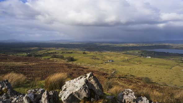 Time lapse of rural and remote landscape of grass, trees and rocks ...