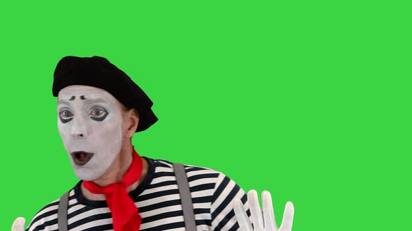 Young Funny Mime Behind an Invisible Wall on a Green Screen, Chroma Key ...