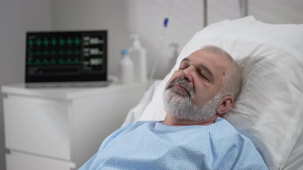 An Elderly Patient Wakes Up Coming Out of a Coma, Stock Footage | VideoHive