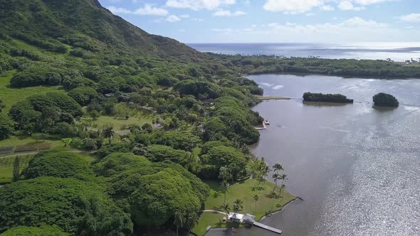 Aerial view of Moli'i pond next to Ko'olau mountain in Oahu Hawaii ...