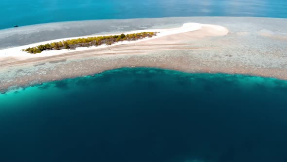 Aerial: Flying over idyllic atoll, scenic travel destination in ...