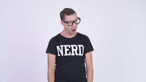 Studio Shot of Tired Nerd Man Yawning, Stock Footage | VideoHive