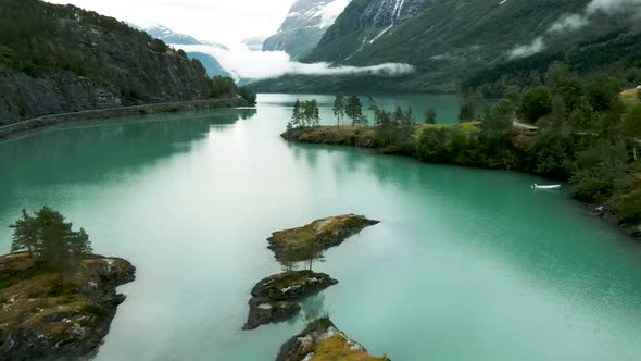 Flying over small islands in the beautiful lake Loen, western Norway ...