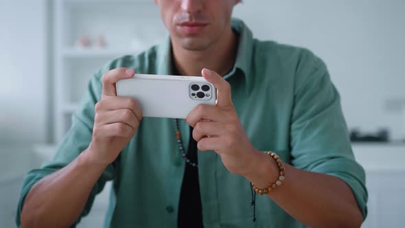 Closeup of Man Playing App Game on a Smartphone Celebrating a Happy ...