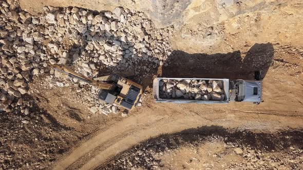 Overhead View of Excavator in Open Air Quarry, Stock Footage | VideoHive