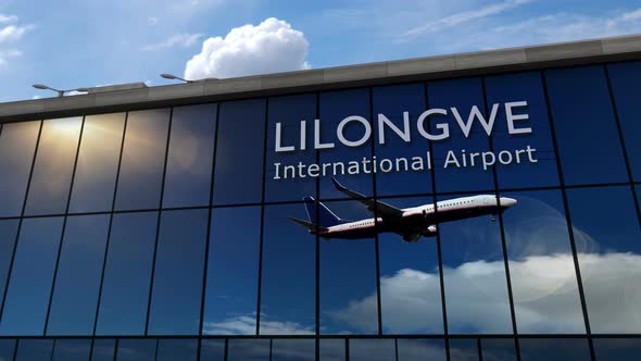 Airplane landing at Lilongwe Malawi airport mirrored in terminal ...