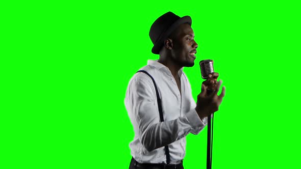 Man Singer in Half of the Turnover Sings Into a Microphone and Dance ...