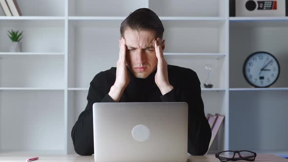 Sad Man Freelancer Looking Stressed Out While Working on His Laptop ...