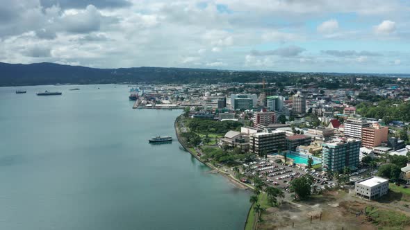 Aerial of coastline of capital city Suva in Fiji with hotels and other ...