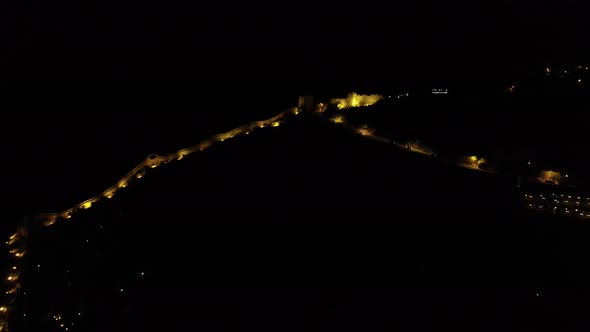 Night View of the Ramparts of a Large Illuminated Castle, Stock Footage