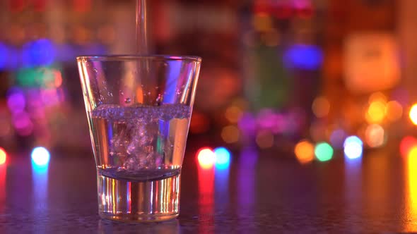 Pouring Two Shots of Clear Alcoholic Drink, Stock Footage | VideoHive