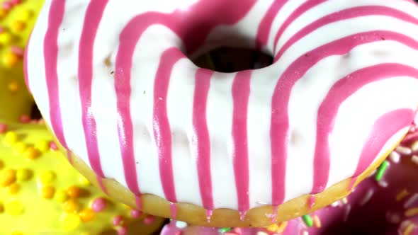 Rotating Donuts with Different Fillings on the Table, Stock Footage