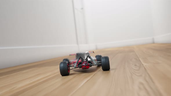 RC car indoor race. Miniature radio-controlled model driving fast in ...