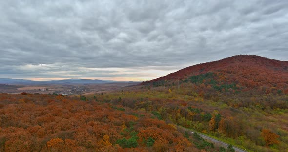 Aerial Top Down View Following a Road in the Middle Down the Hill From ...